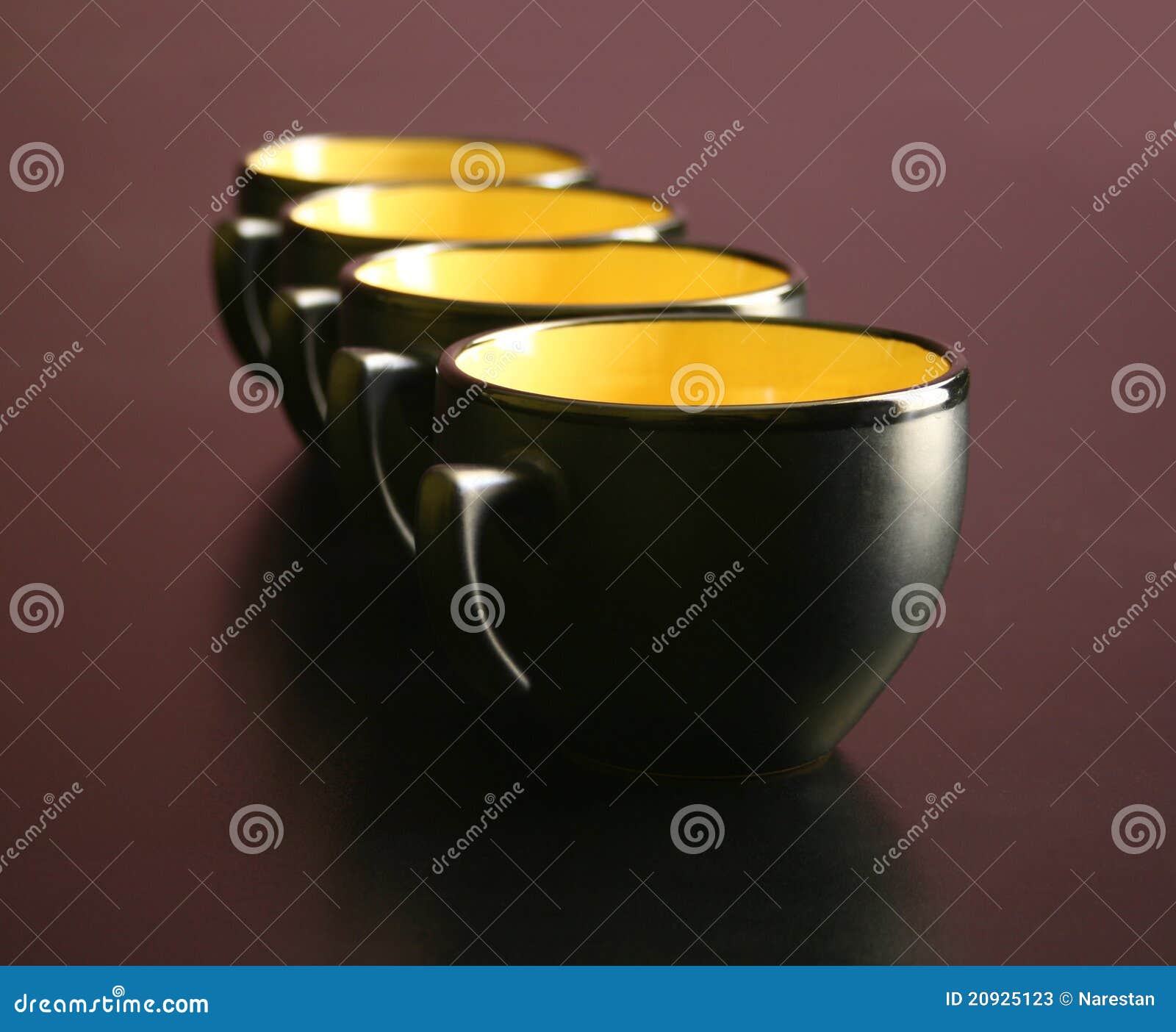 Four cups on desk stock image. Image of black, yellow - 20925123