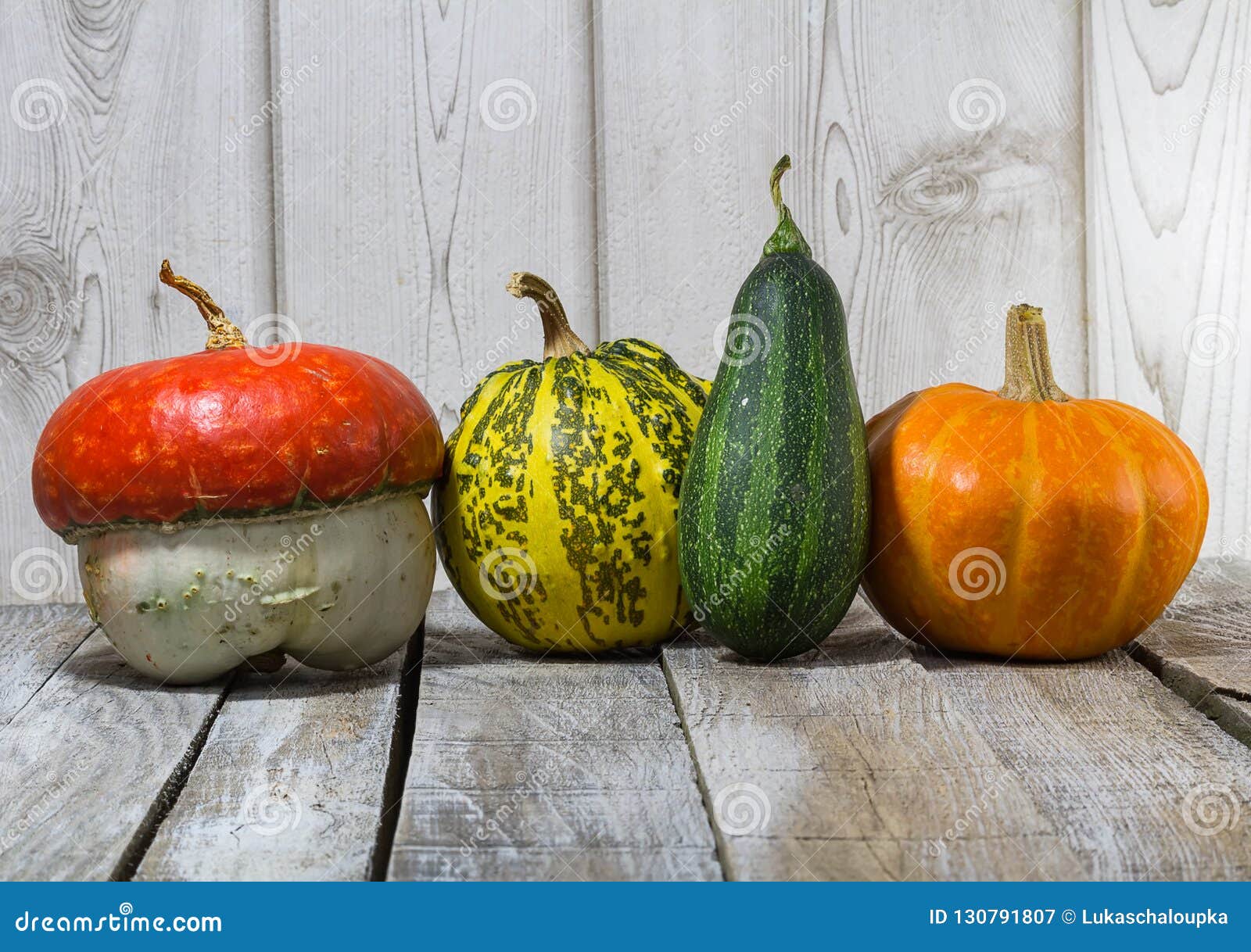 Four Decorative Pumpkin on Wood Background Stock Image - Image of ...