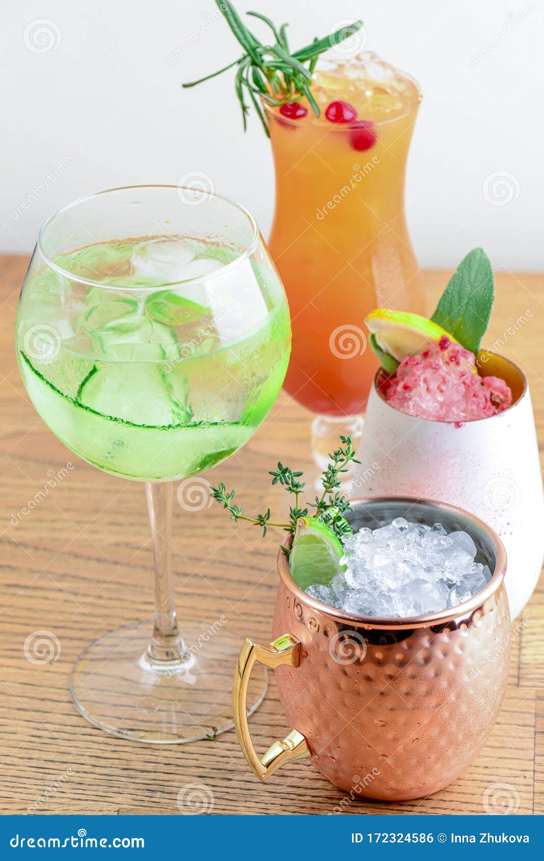 Four Different Assorted Cocktail Drinks Made with Alcohol and Fruit ...