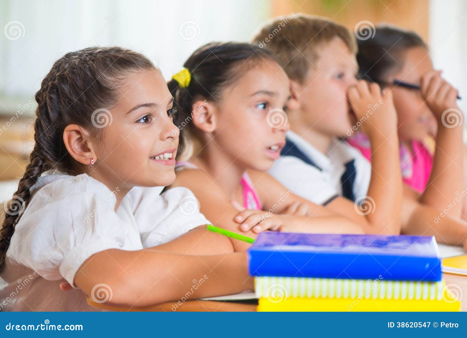 Four Diligent Pupils Studying at Classroom Stock Image - Image of ...