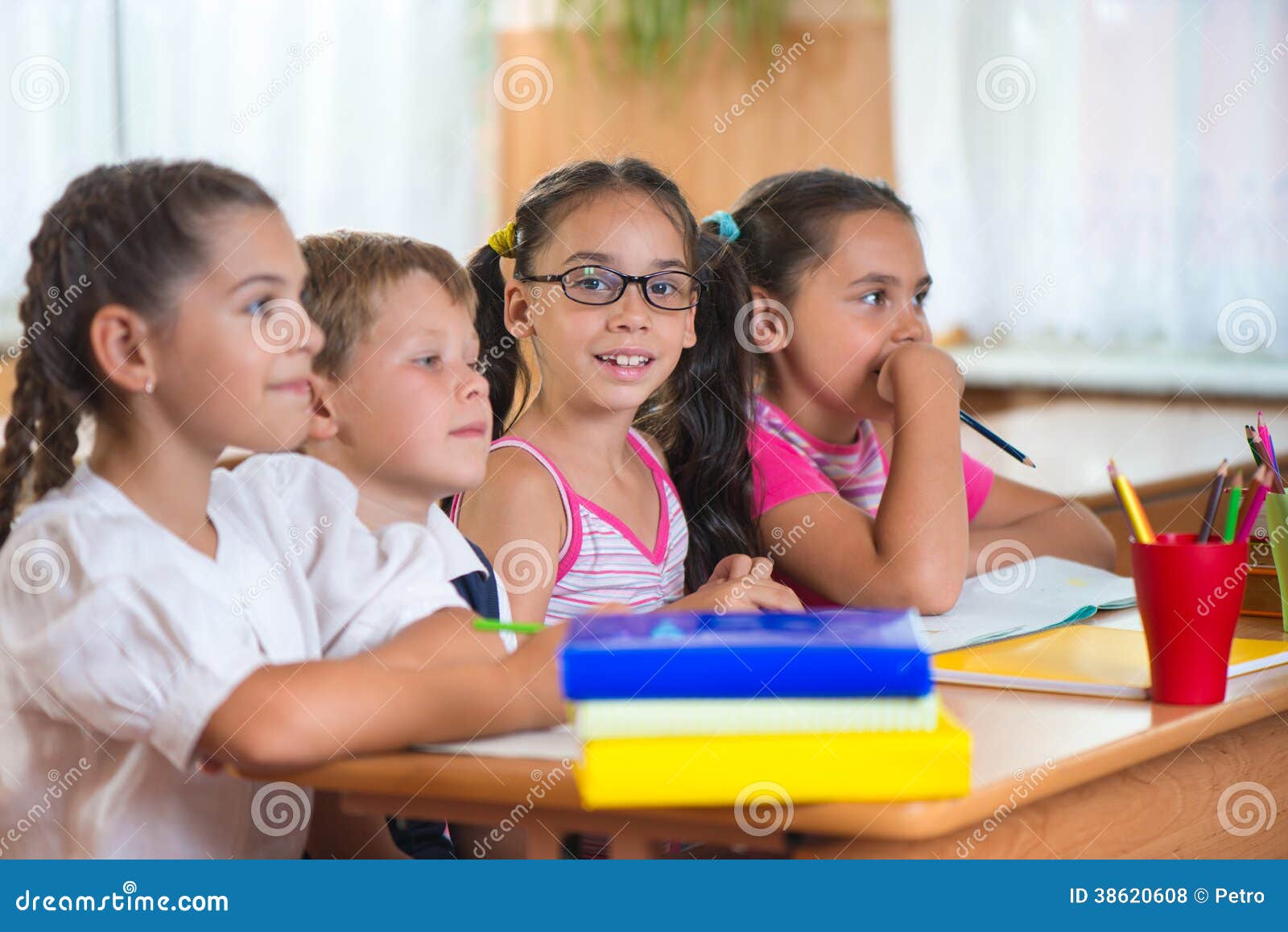 Four Diligent Pupils Studying at Classroom Stock Photo - Image of ...