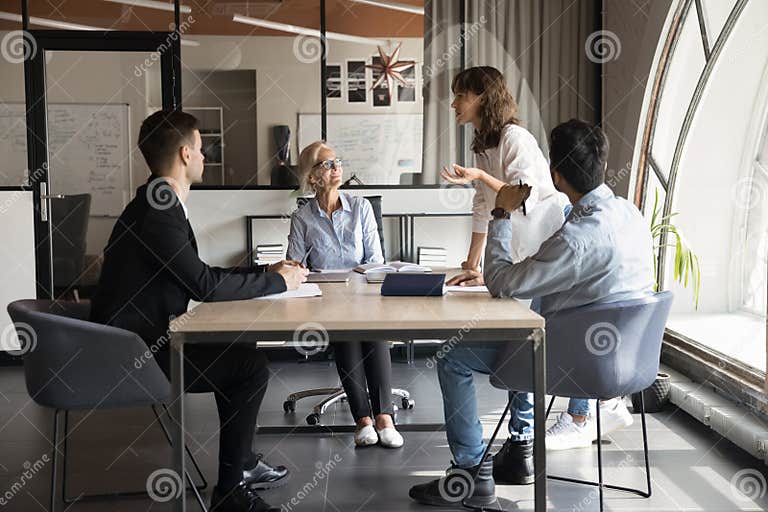 Four Diverse Colleagues Solve Work-related Issues in Conference Room ...