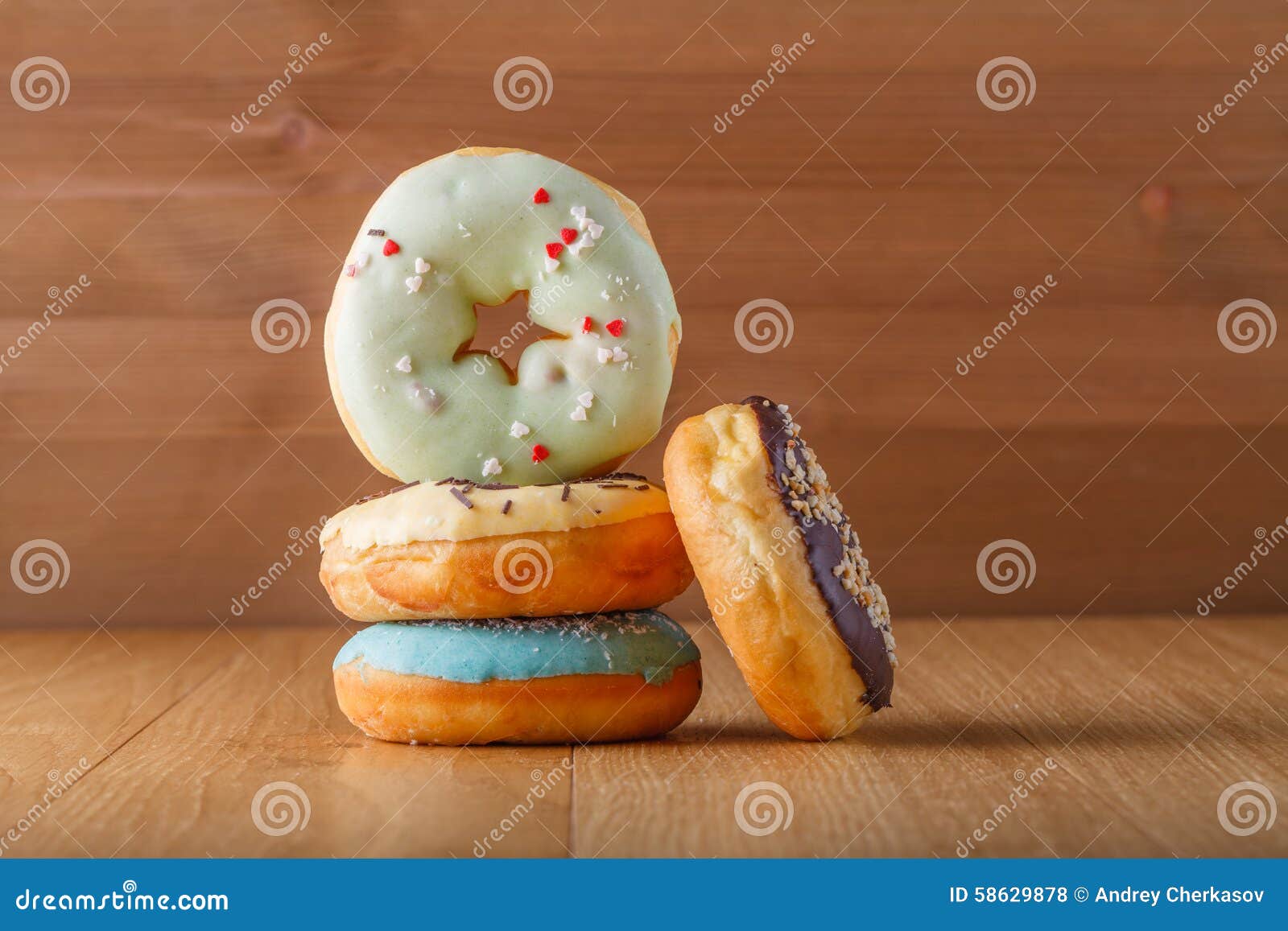 Four donut on table stock photo. Image of snack, icing - 58629878