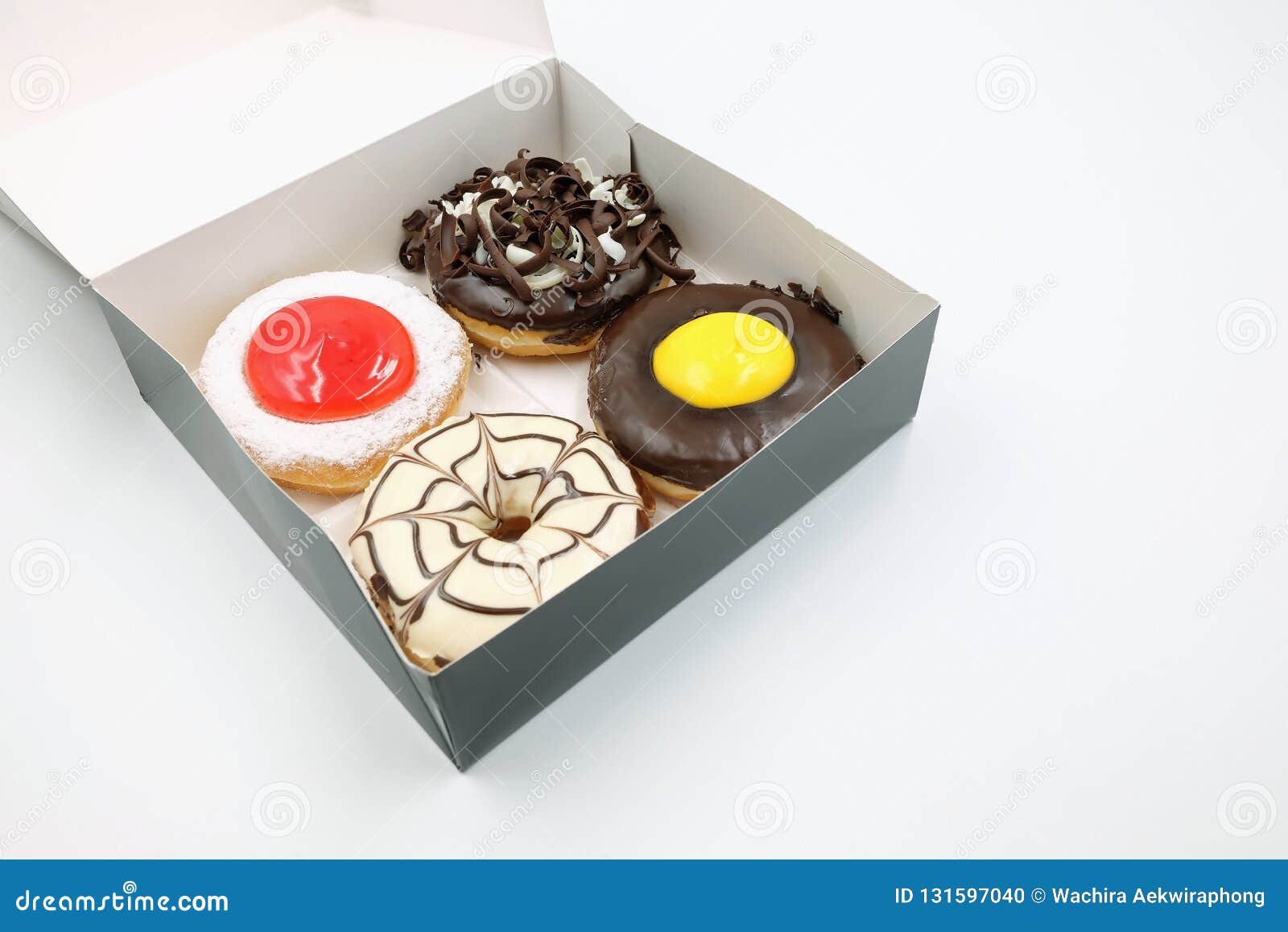 Four Donuts in Box on White Background Stock Photo - Image of differant ...