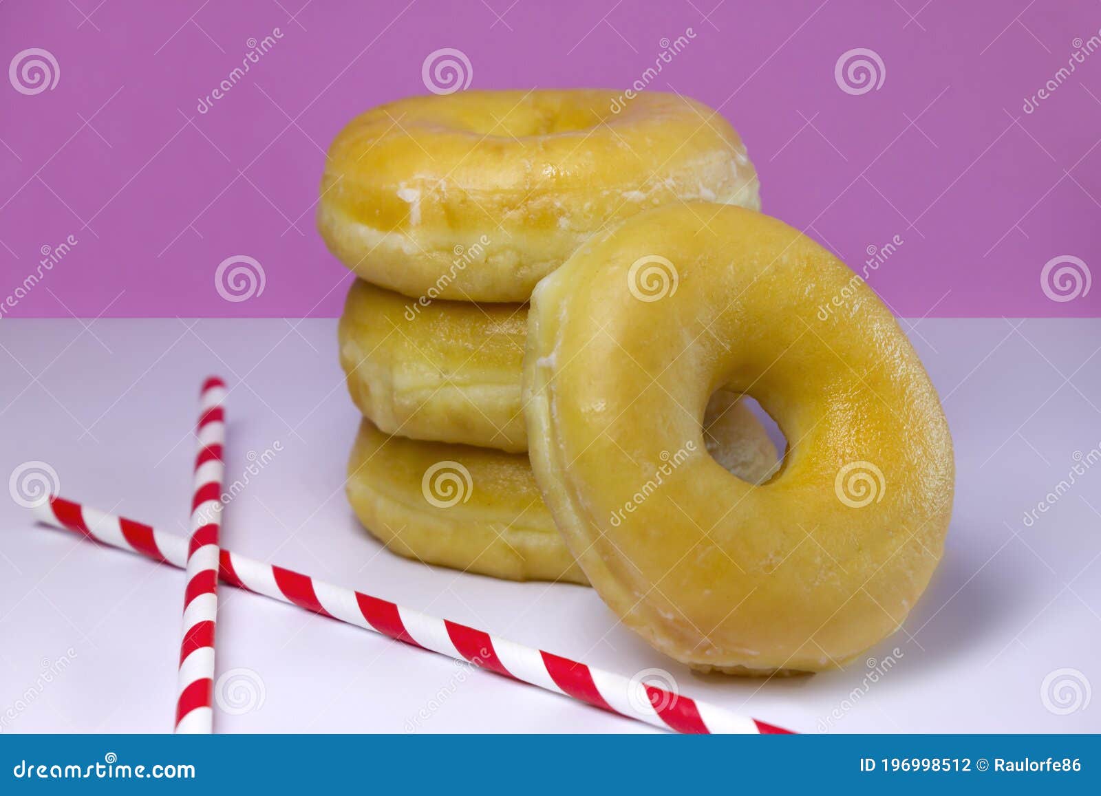 Four Donuts or Classic Donuts Stack with Two Red Stripe Straw on a ...