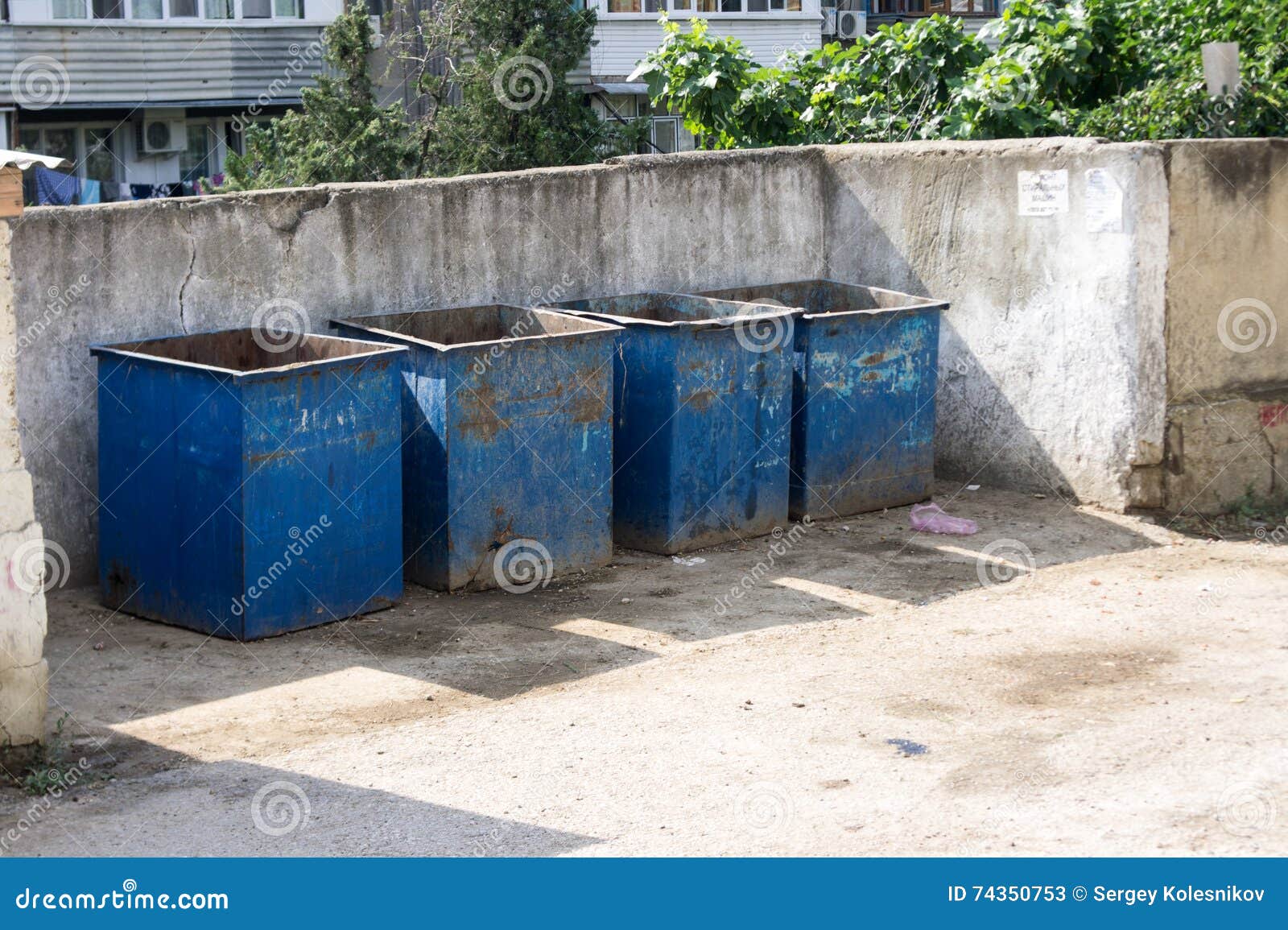 Four Empty Containers for Trash on the Street Stock Image - Image of ...