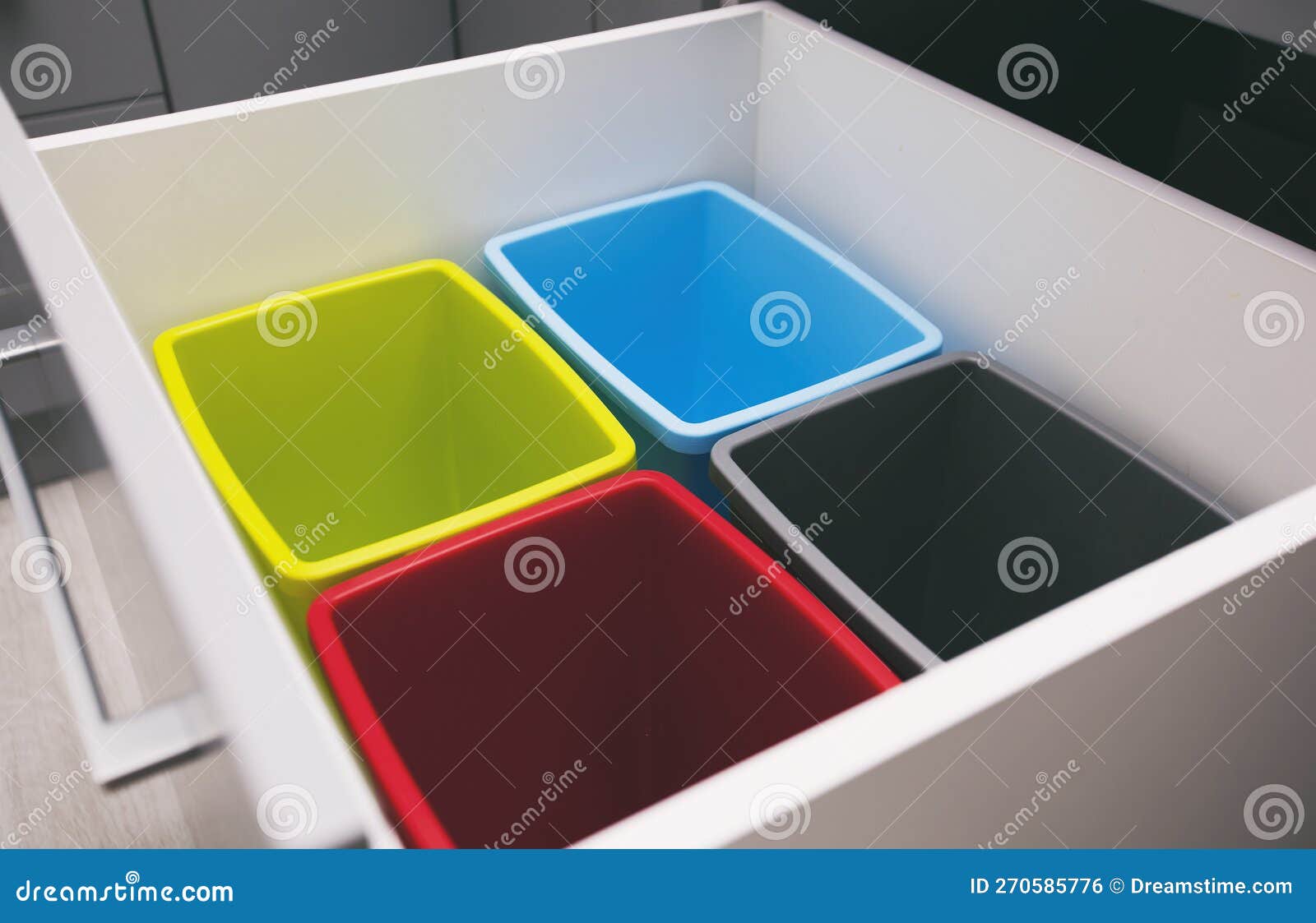 Four Empty Plastic Trash Bins in the Shelf in the Kitchen Stock Photo ...