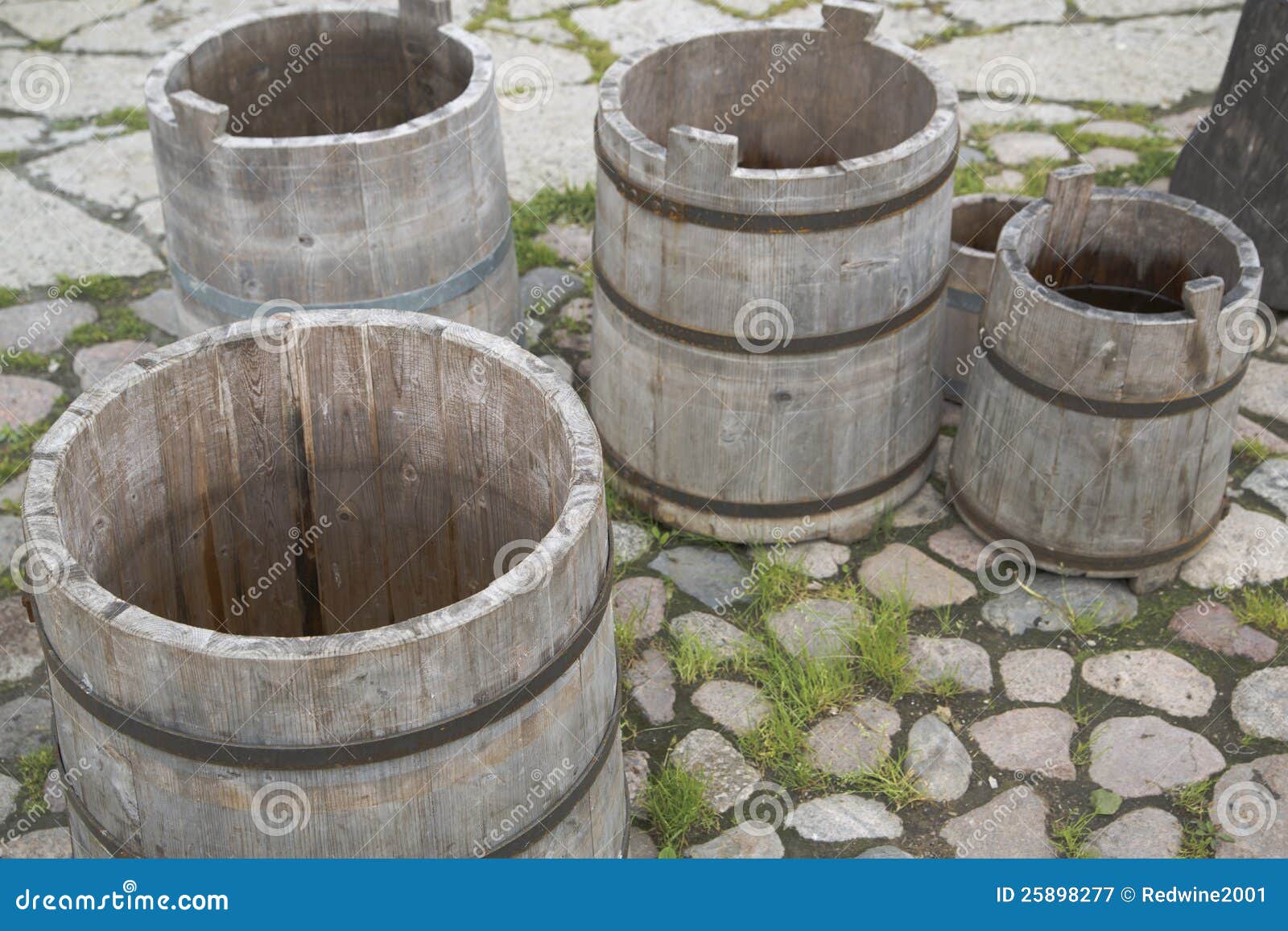 Four Empty Water Barrels on Stony Yard Stock Image - Image of pipe ...