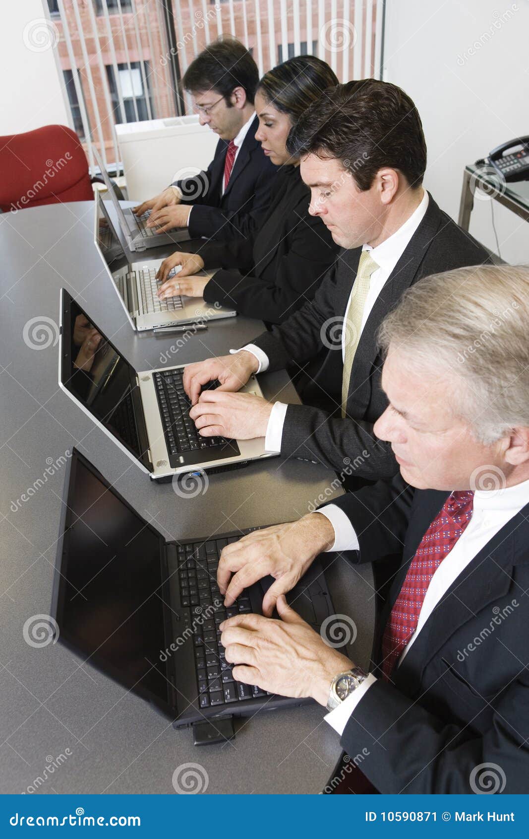 Four Executives with Laptops. Stock Image - Image of caucasian, adult ...