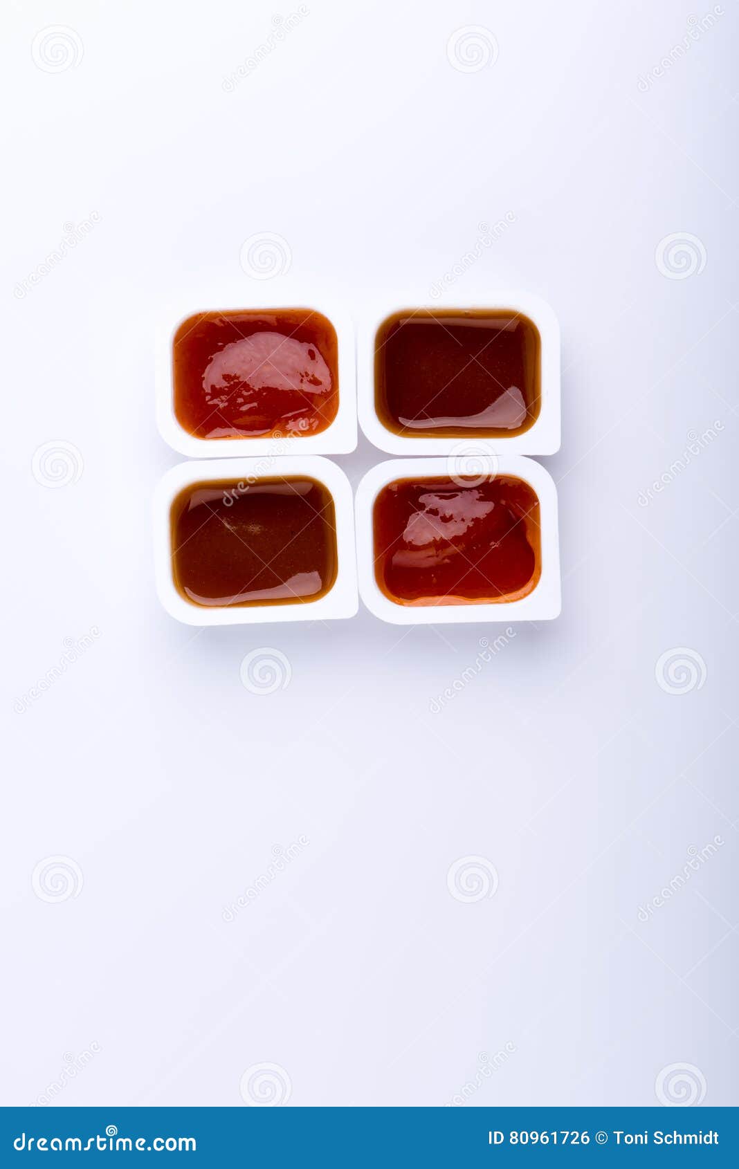 Four Fast Food Dip Sauces In Plastic Containers Arranged As Rect Stock ...