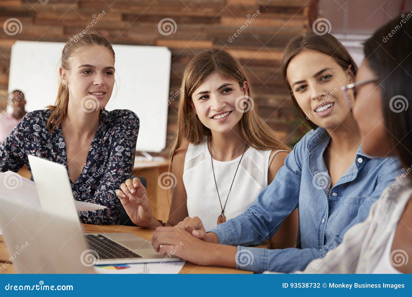 Four Female Colleagues Working Together in an Office Stock Photo ...