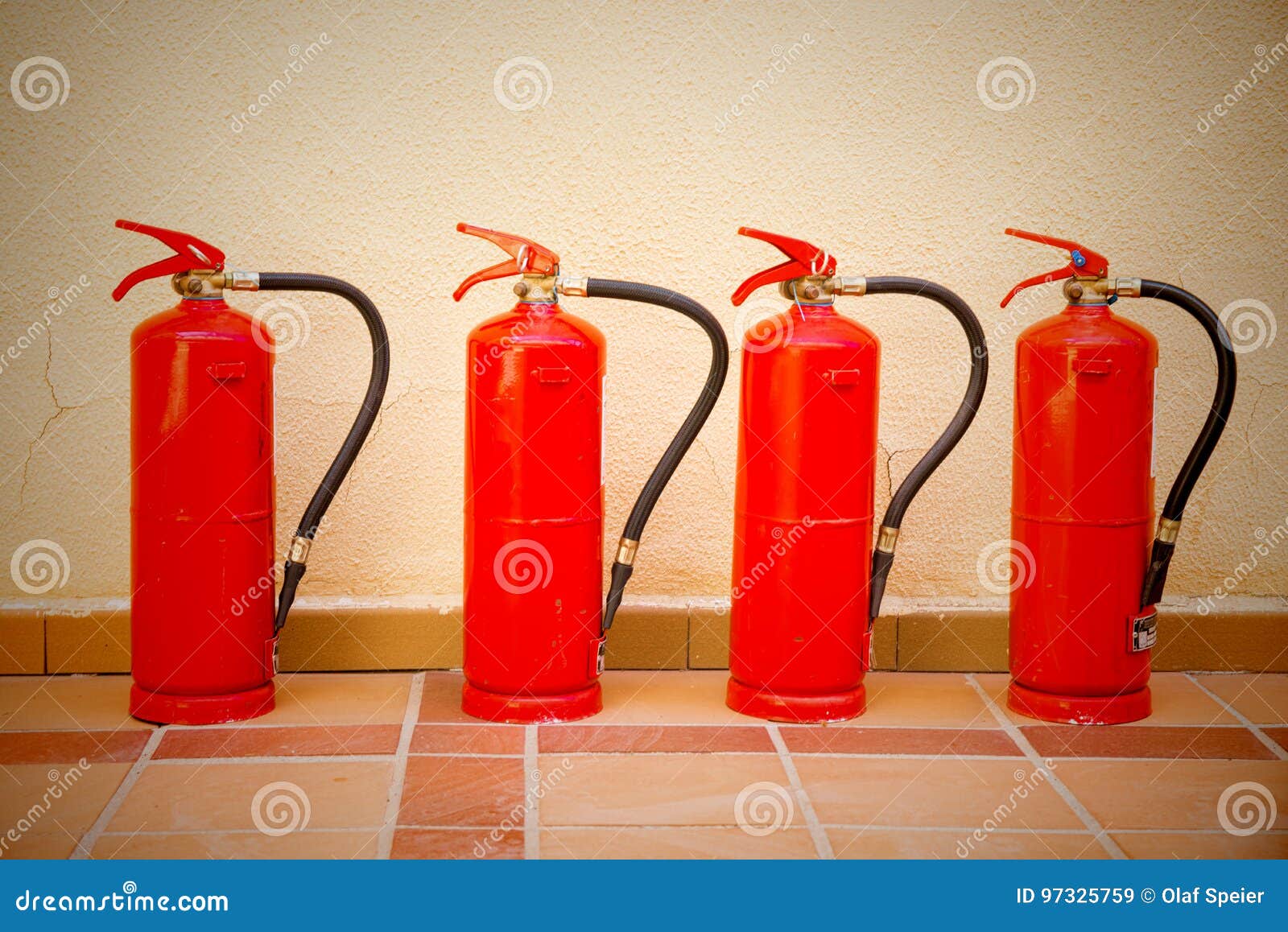 Four fire extinguishers stock image. Image of safety - 97325759