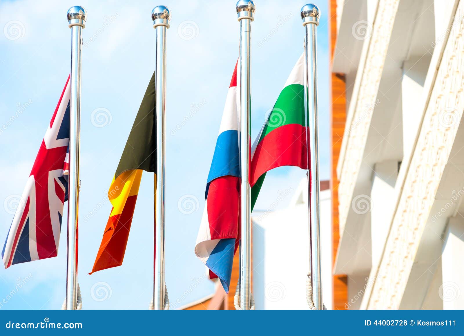 Four flags on flagpoles stock photo. Image of germany - 44002728