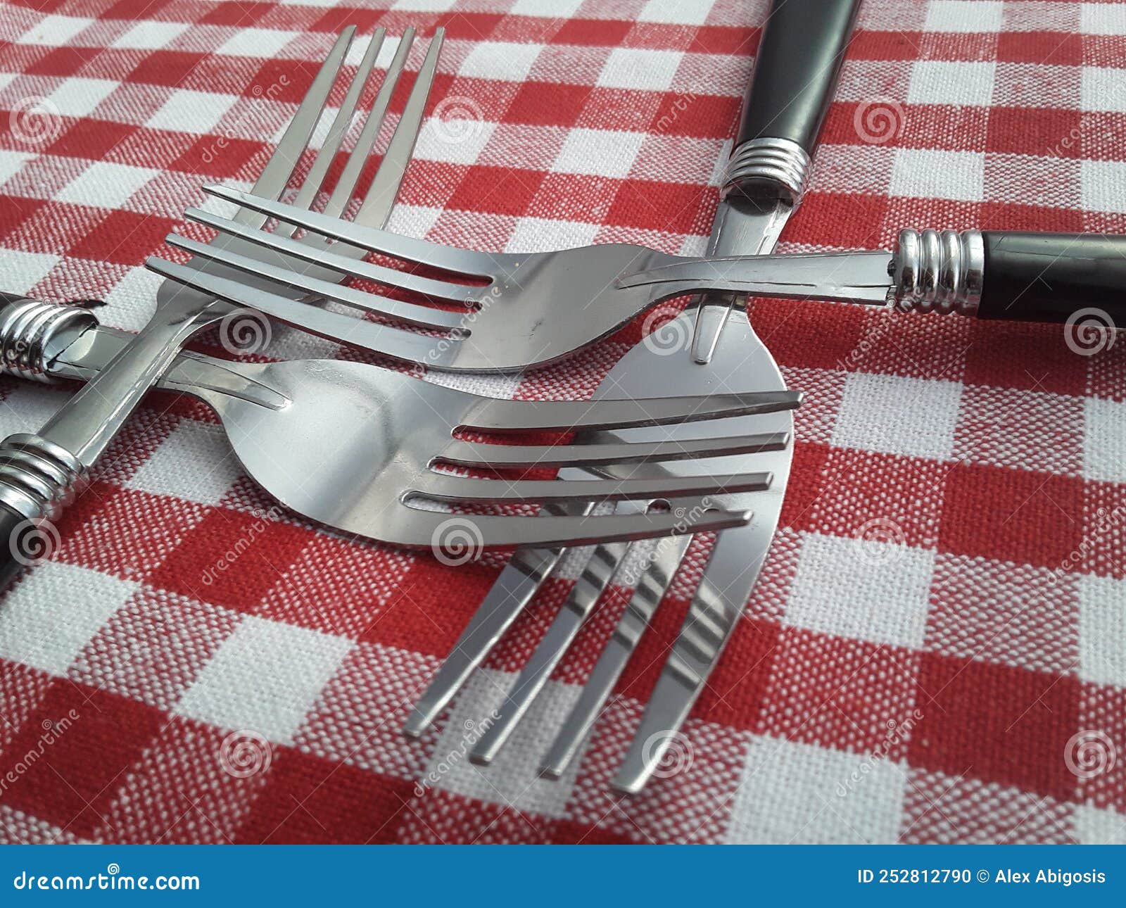 Four Forks Isolated on a Red and White Checkered Background Stock Photo ...