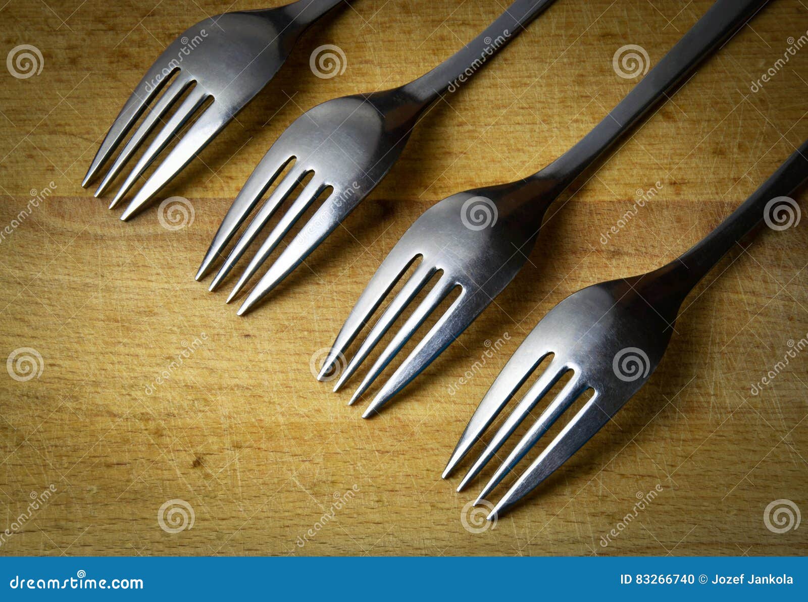 Four Forks Obliquely on Wood Stock Photo - Image of group, dinner: 83266740