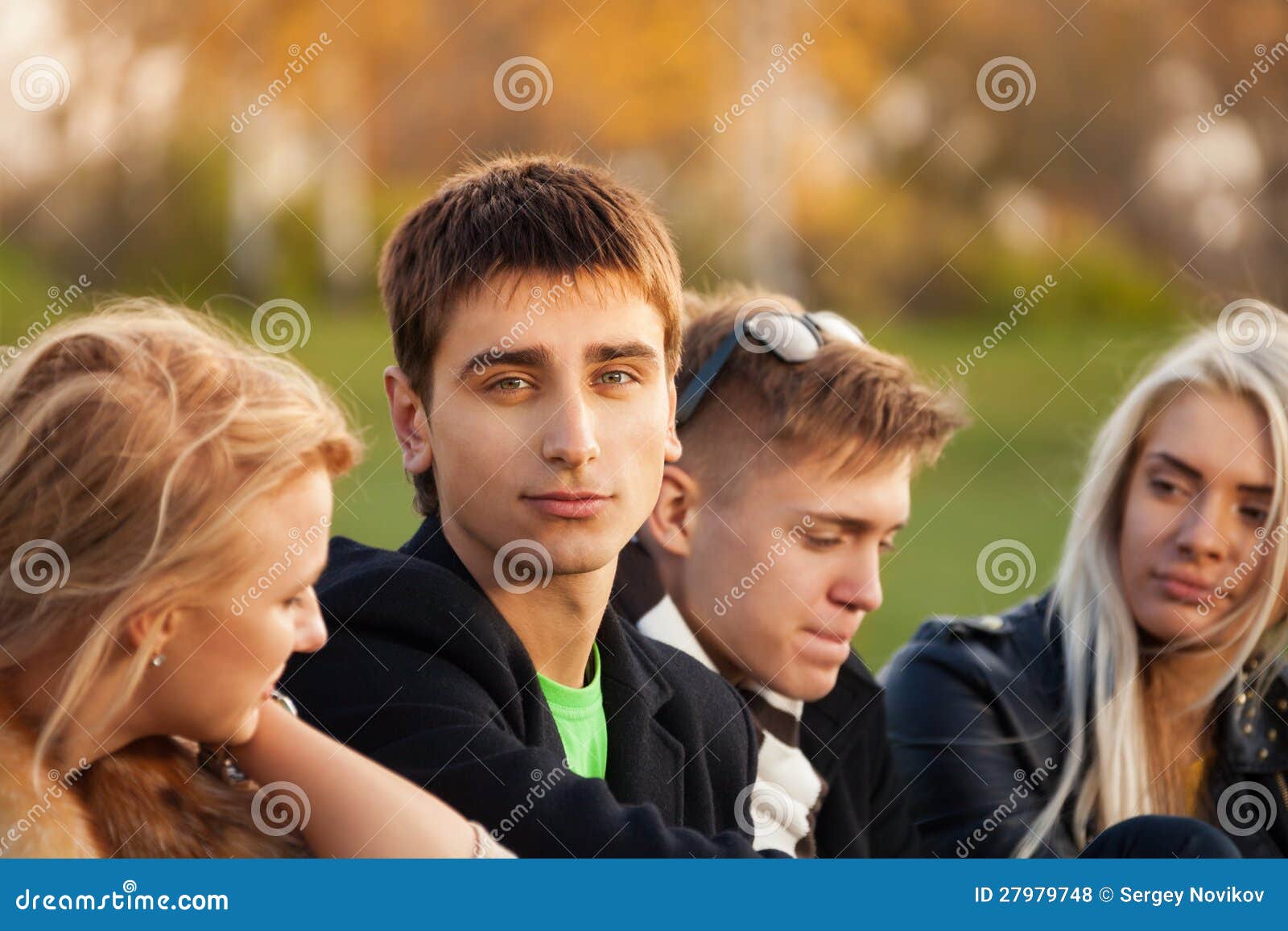 Four friends after classes stock photo. Image of coat - 27979748