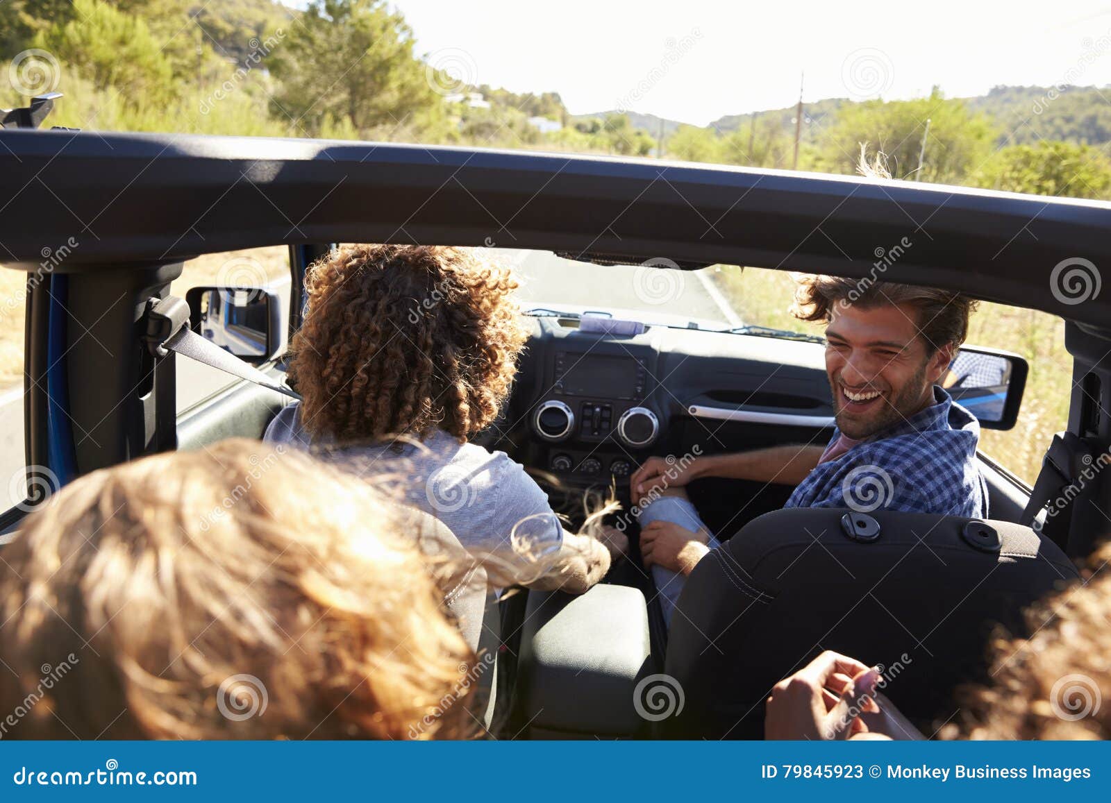 Four Friends Driving in an Open Top Car, Elevated View Stock Image ...