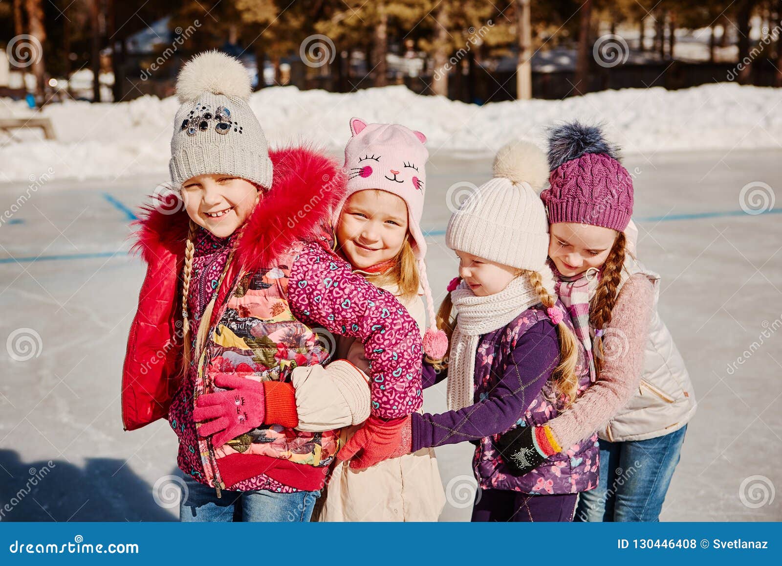 Four Friends Have Fun at the Rink Stock Photo - Image of people ...