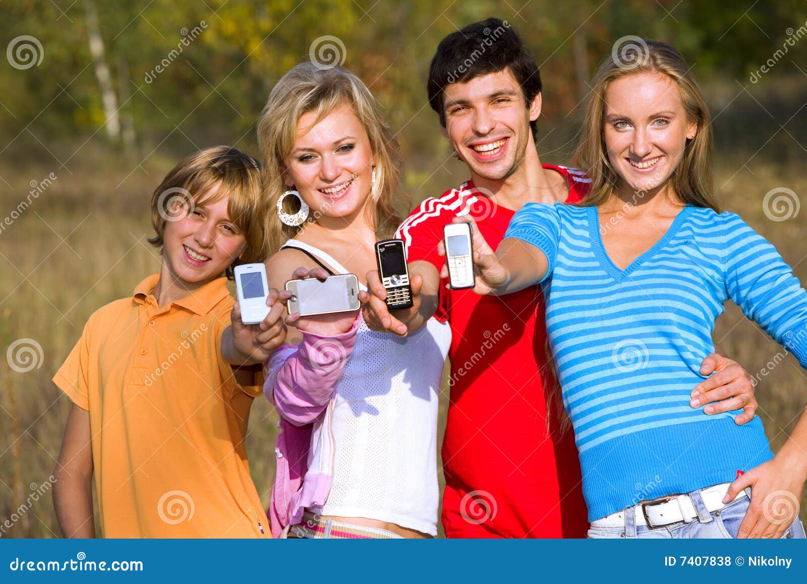 Four Friends with Mobile Phones Stock Photo - Image of park, happy: 7407838