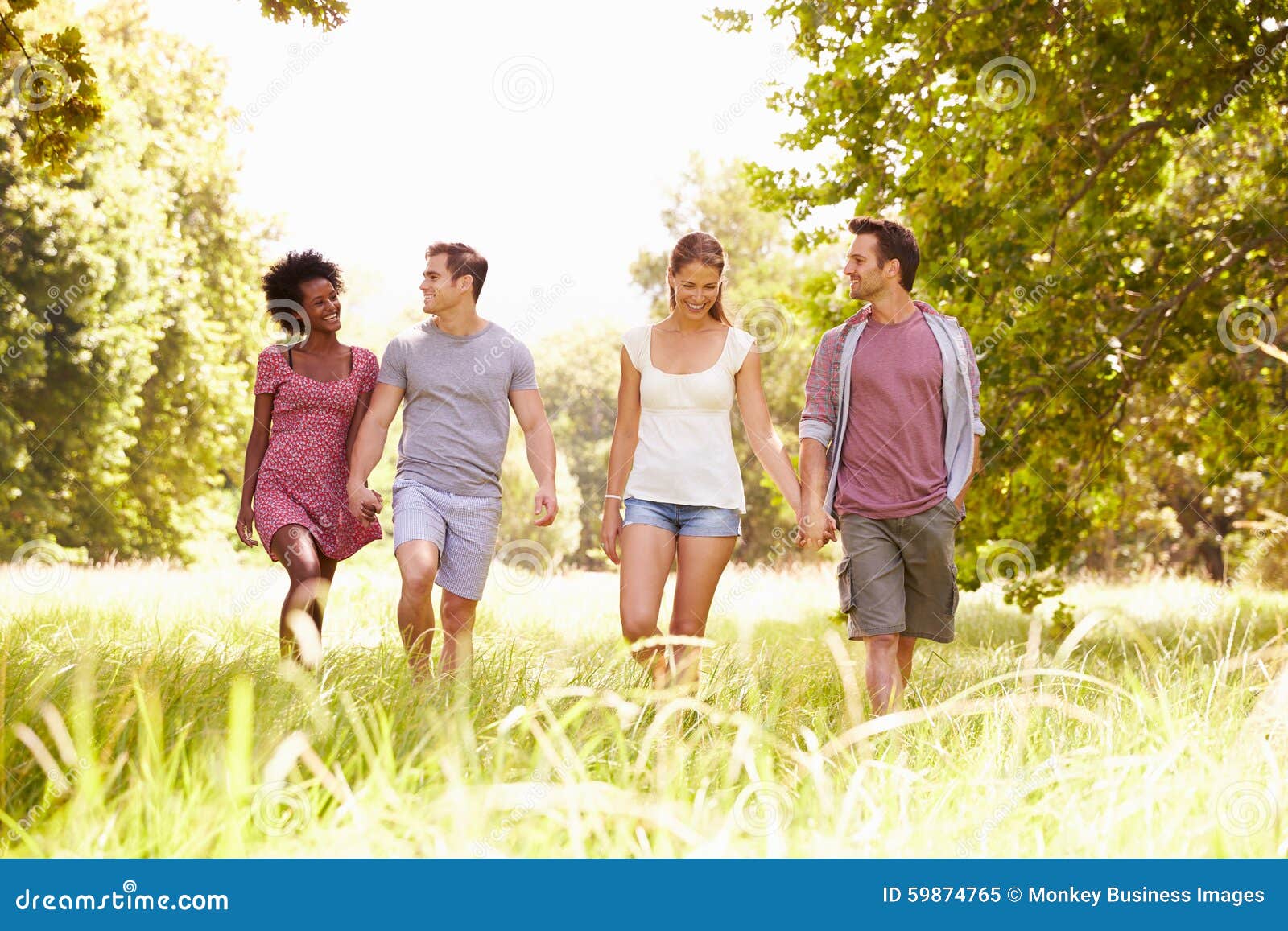 Four Friends Walking Together in the Countryside Stock Image - Image of ...