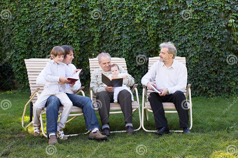 Four Generations of Men Reading in the Garden Stock Image - Image of ...