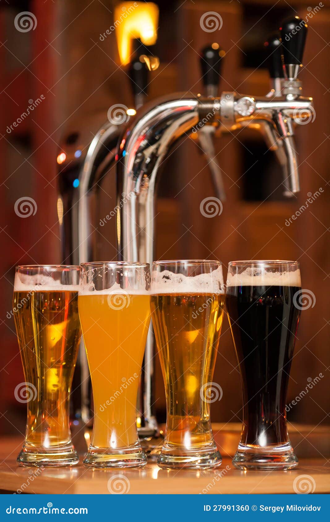 Four glasses of beer stock photo. Image of alcohol, party - 27991360