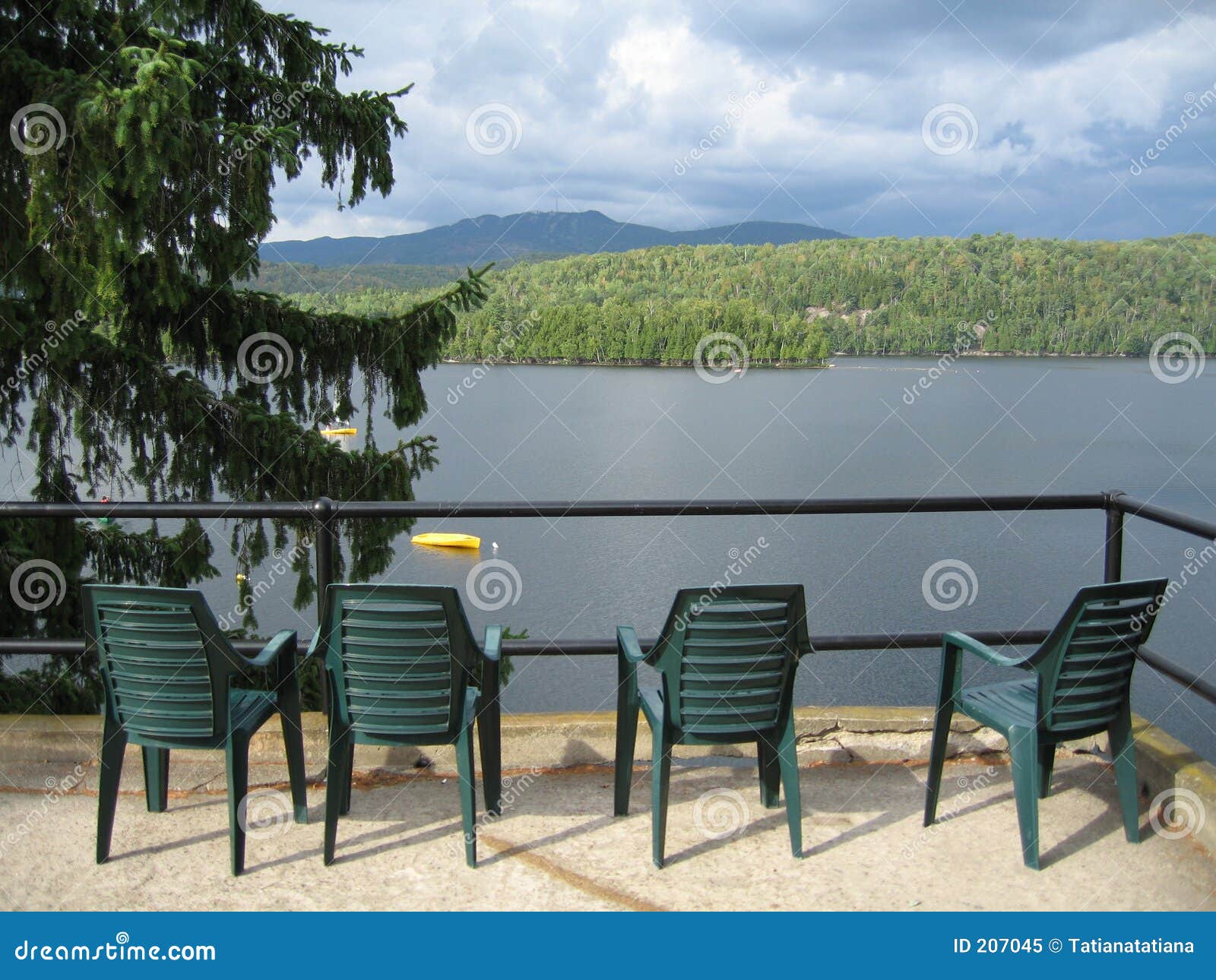 Four Green Chairs Overlooking a Lake Stock Image - Image of mountains ...