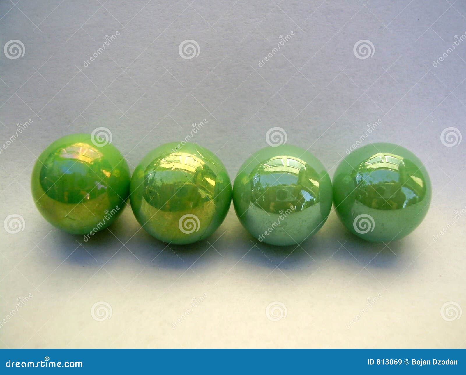 Four green marbles stock image. Image of glossy, touching - 813069