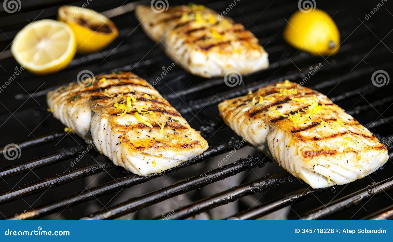 Four Grilled Fish Fillets with Lemon Slices on a Grill Stock Photo ...
