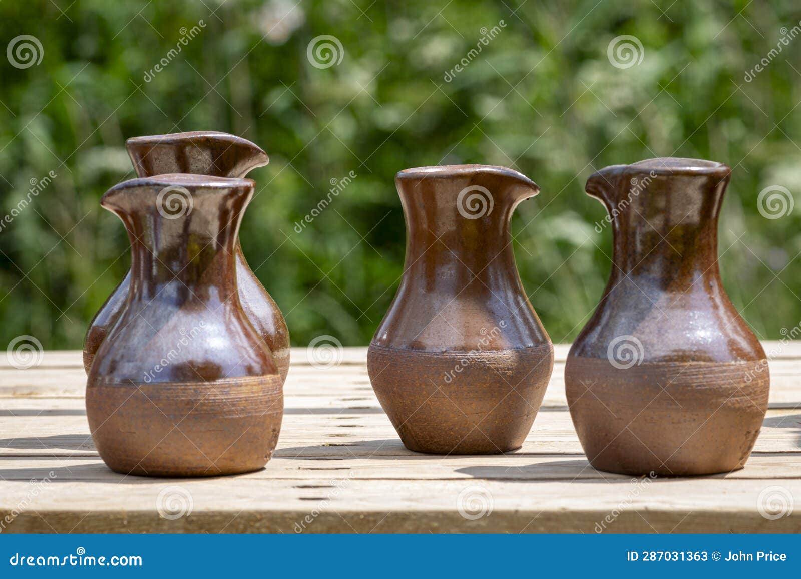 Four handmade clay jugs stock image. Image of four, wooden - 287031363