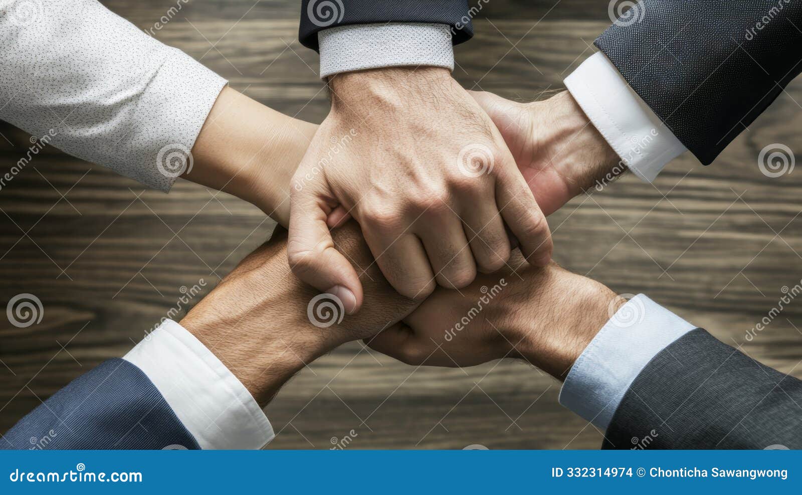 Four Hands Clasped Together in Unity, Symbolizing Teamwork ...