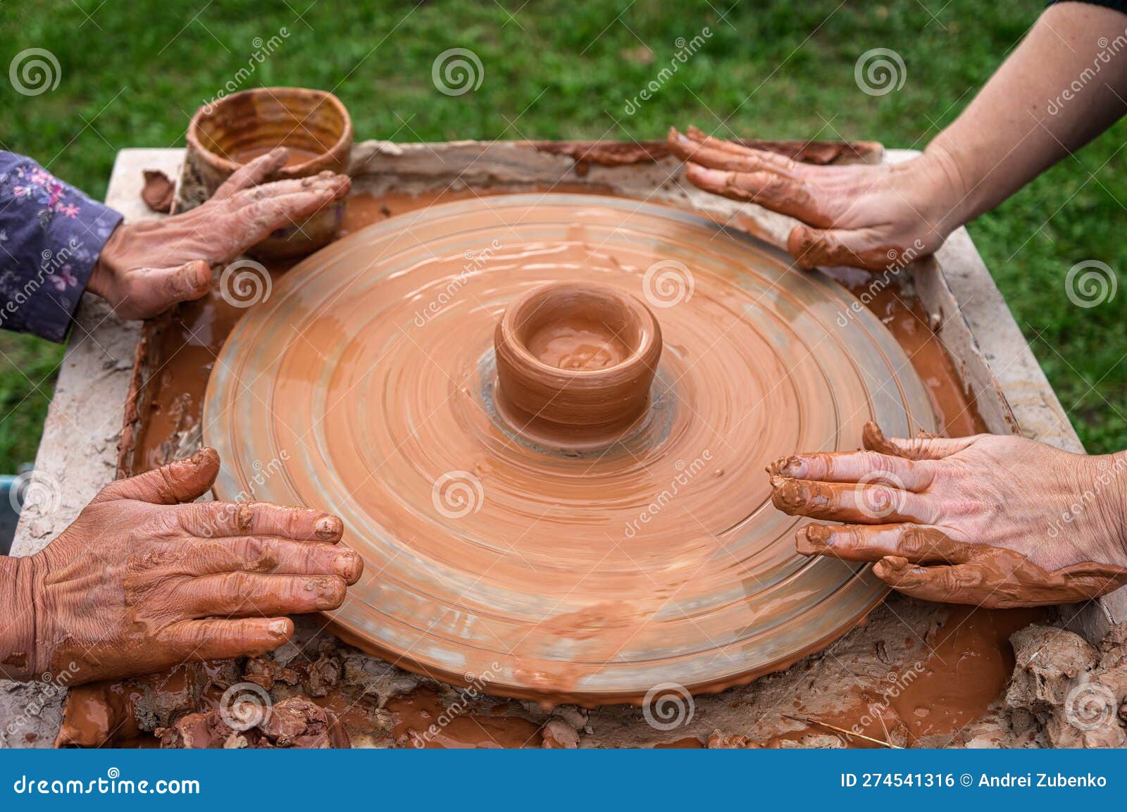 Four Hands at the Corners of a Potter S Wheel. Master and Apprentice in ...