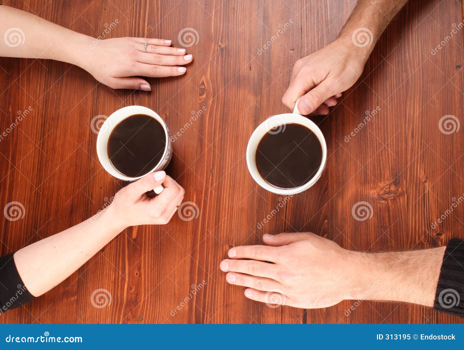 Four Hands on the table stock image. Image of friendship - 313195