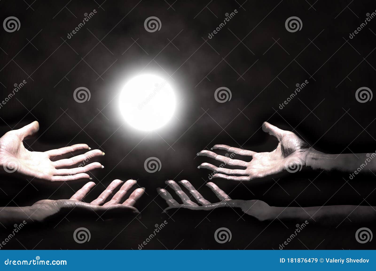 Four Hands Under the Sun Against a Dark Background 3 Stock Image ...