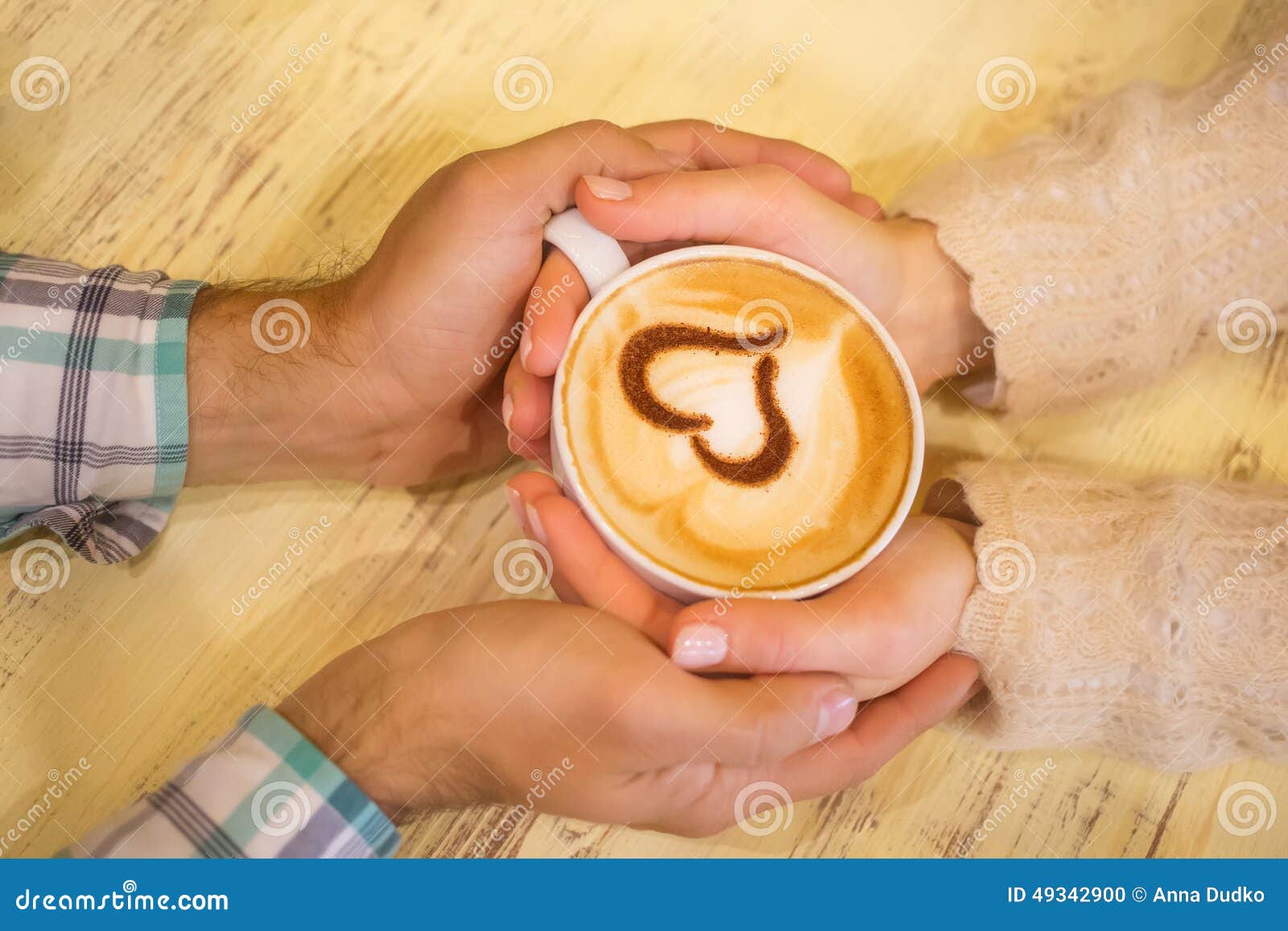 Four Hands Wrapped Around a Cup of Coffee Stock Photo - Image of heart ...