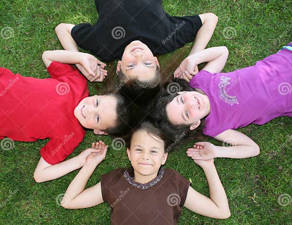 Four Happy Children stock photo. Image of laying, group - 2240820