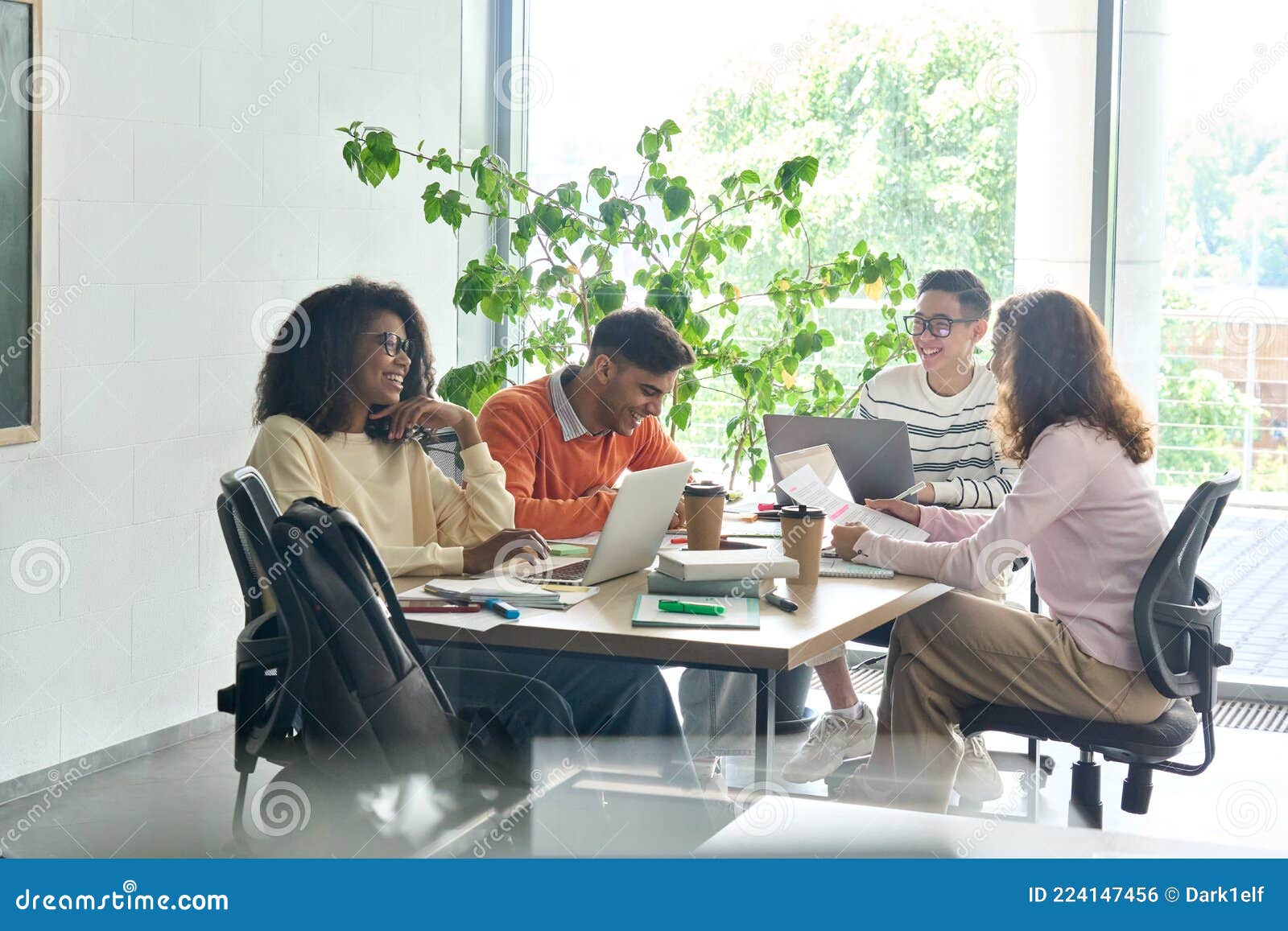 Four Happy Colleagues Creative Team Working Together in Office Using ...