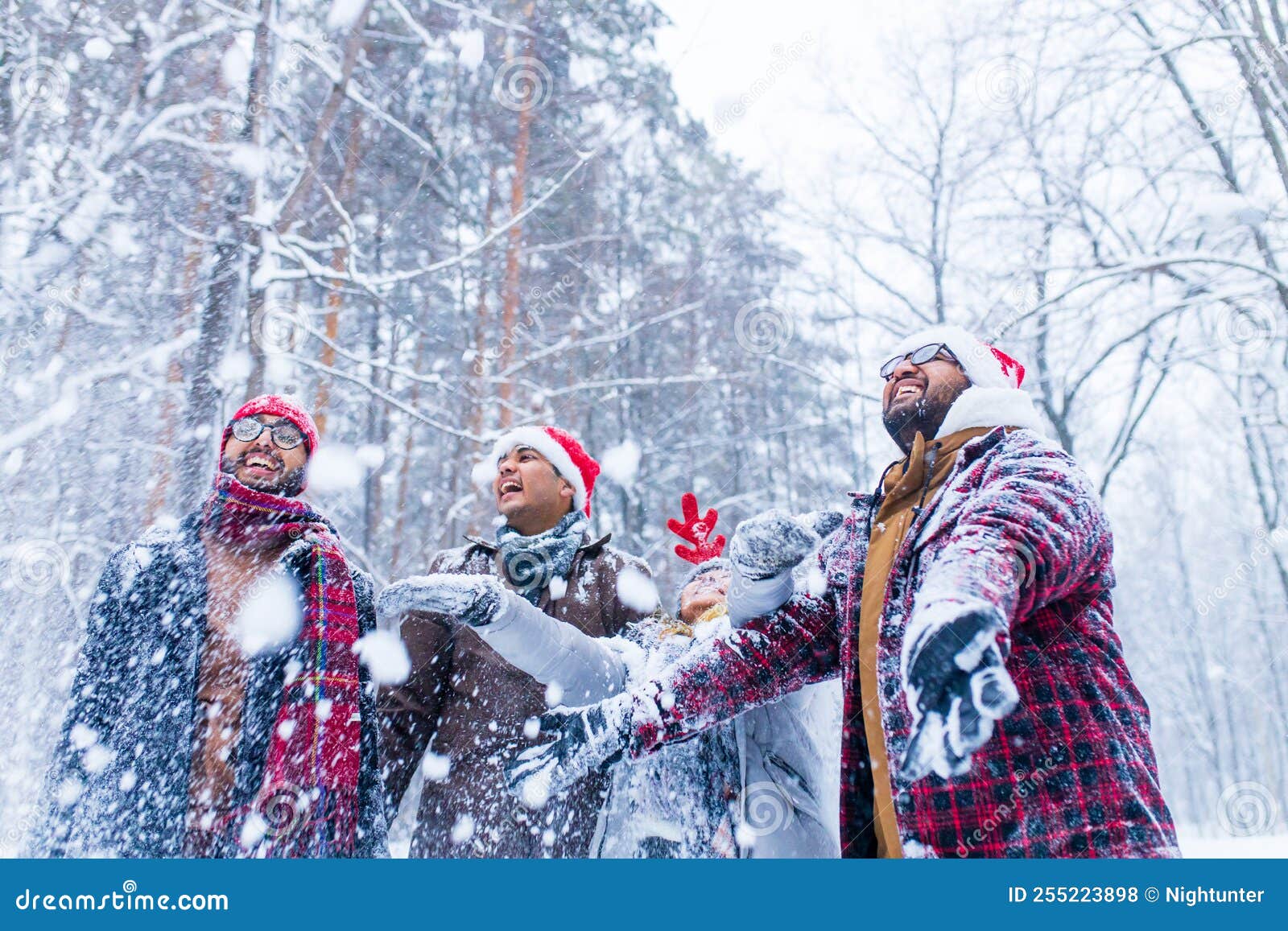 Four Happy Friends are Having Fun and Throwing Snow Stock Photo - Image ...