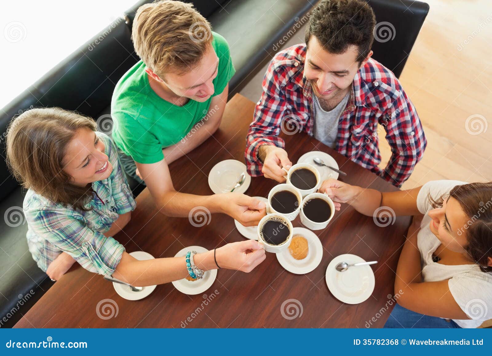 Four Happy Students Having a Cup of Coffee Chatting Stock Photo - Image ...