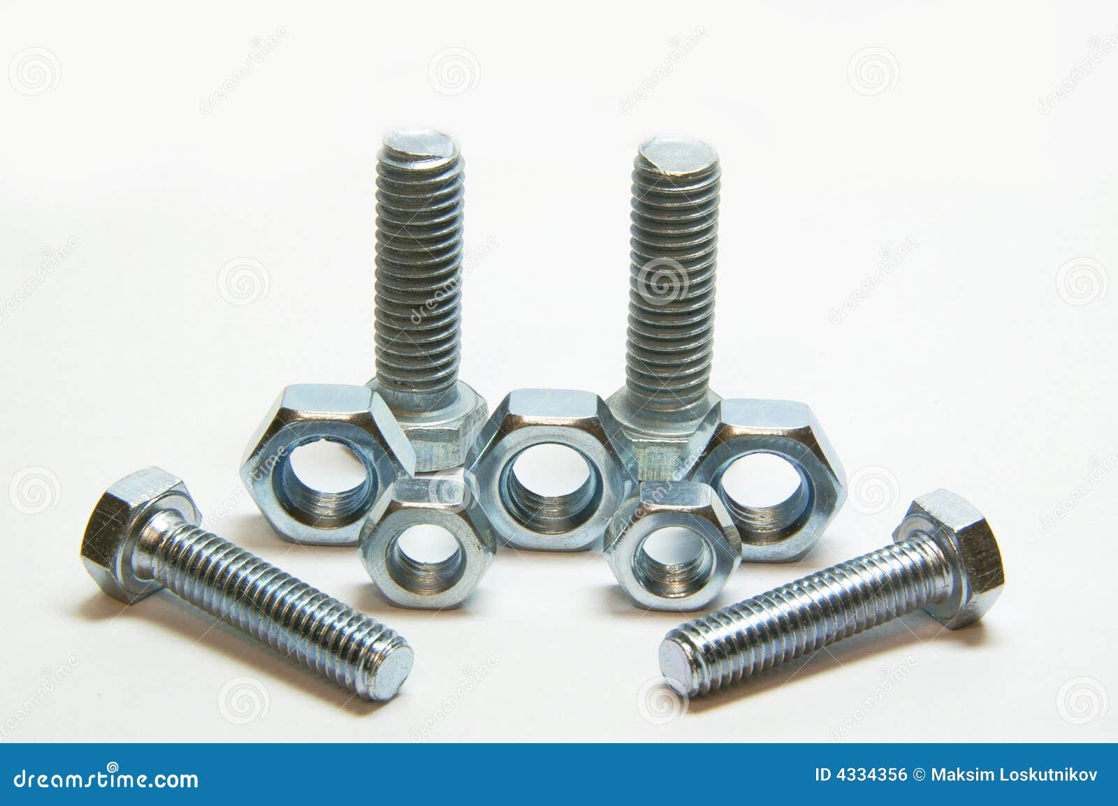Four Head Bolts and Five Nuts Stock Photo - Image of fastener, grooved ...