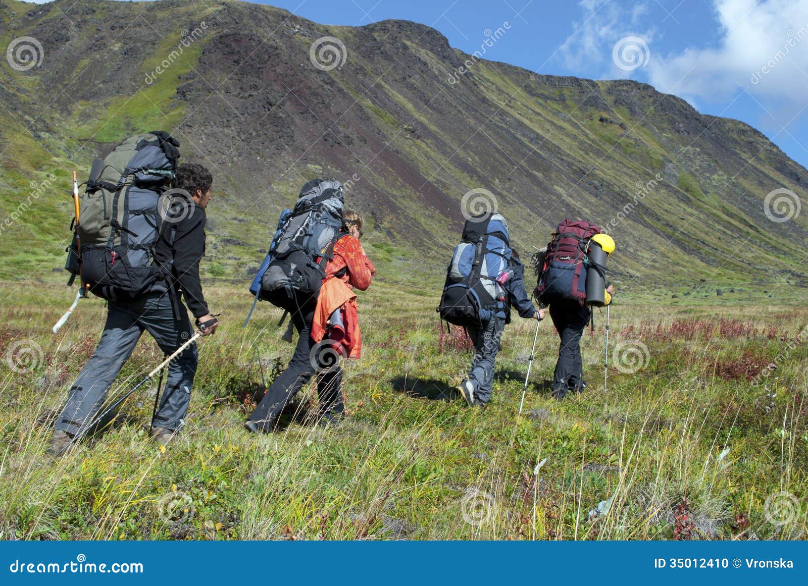 Four hikers stock photo. Image of climbing, blue, high - 35012410