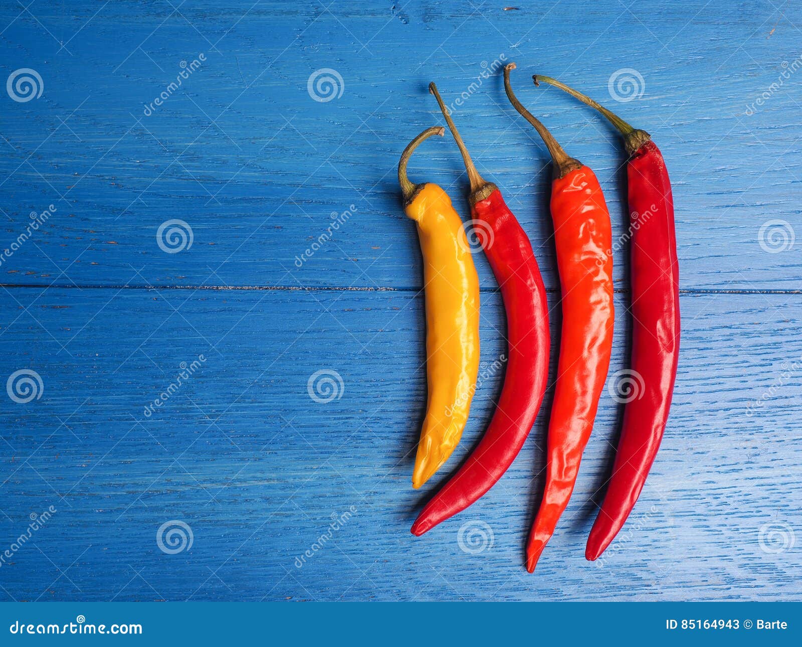 Four hot chilies stock image. Image of rustic, healthy - 85164943