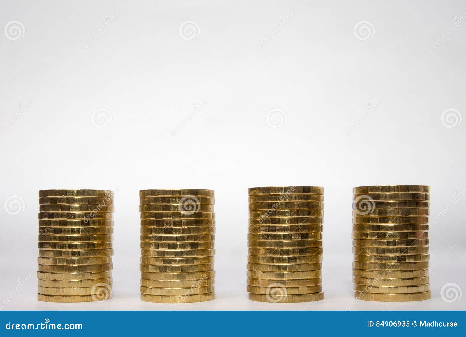 Four Identical Height of Stack of Coins on a Light Background, the Top ...
