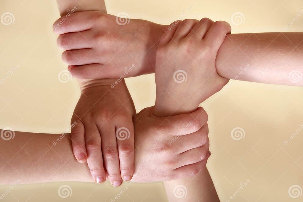 Four Interlocking Children S Hands Stock Photo - Image of support ...