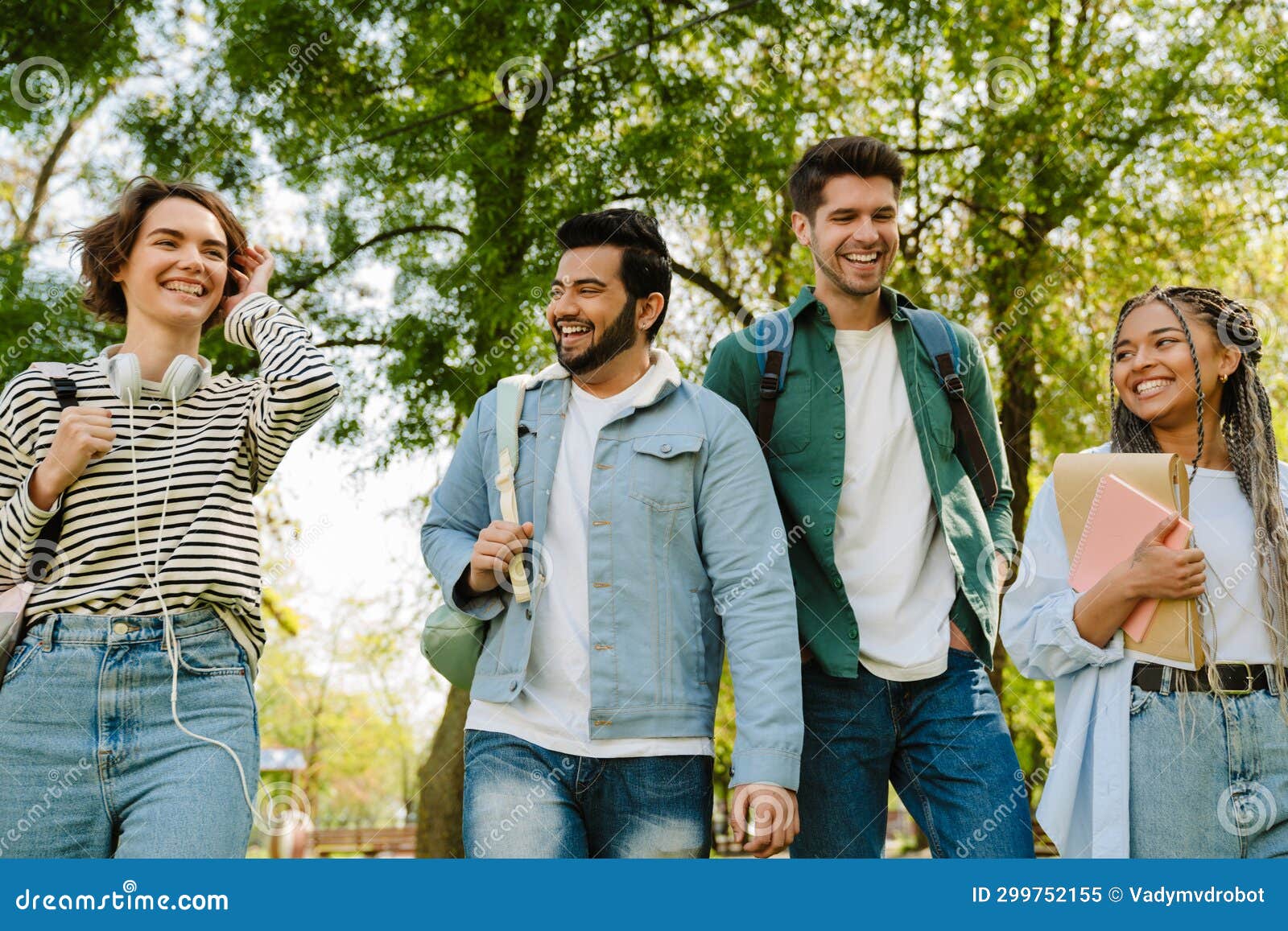 Four Joyful Students Walking Together in Park Stock Image - Image of ...