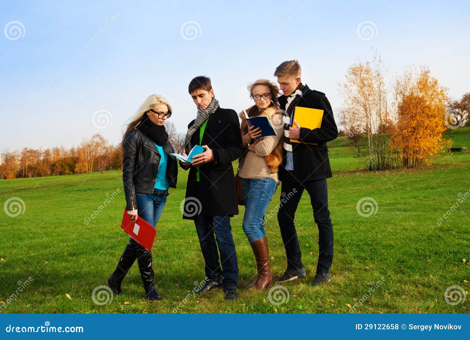 Four kids chatting in park stock photo. Image of adults - 29122658
