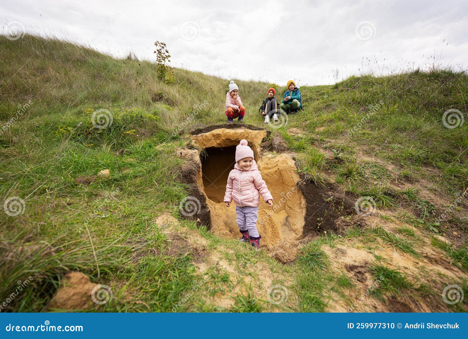 Four Kids Explore Limestone Stone Cave at Mountain Stock Photo - Image ...