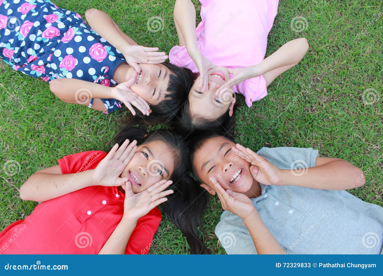 Four Kids Having Fun In The Park. Stock Image - Image of humor, cheeks ...