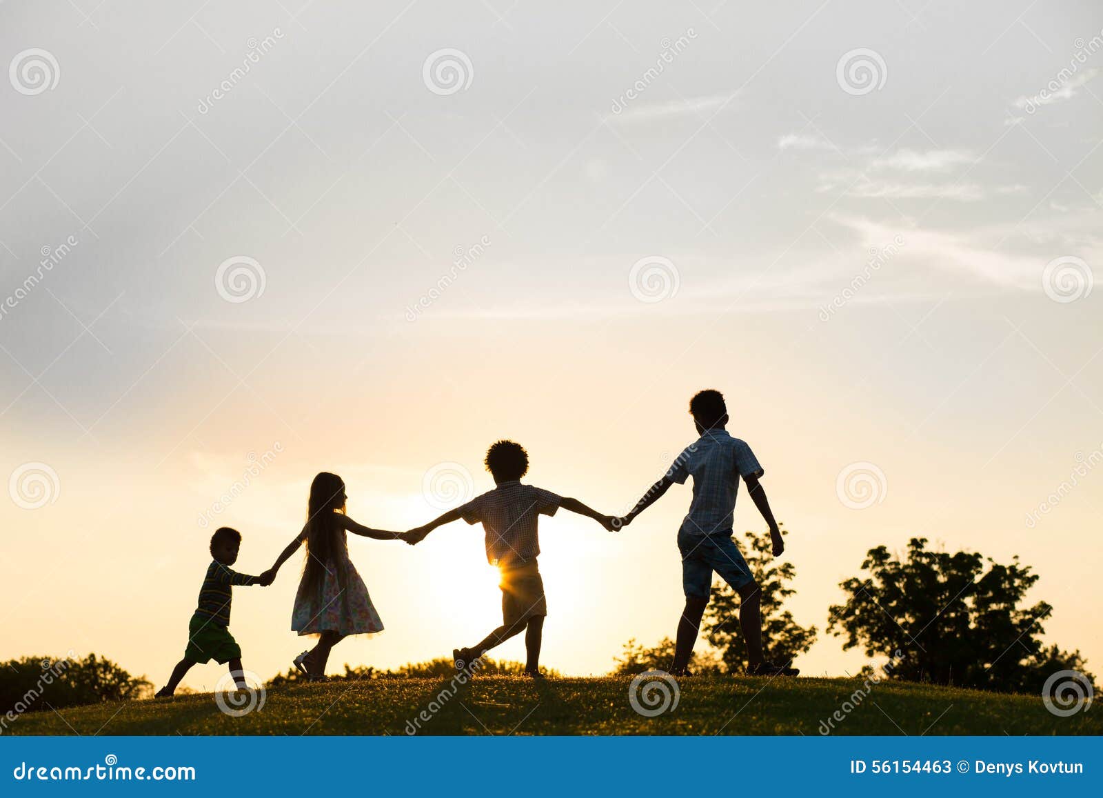 Four Kids are Playing on Sunset. Stock Image - Image of company, nature ...