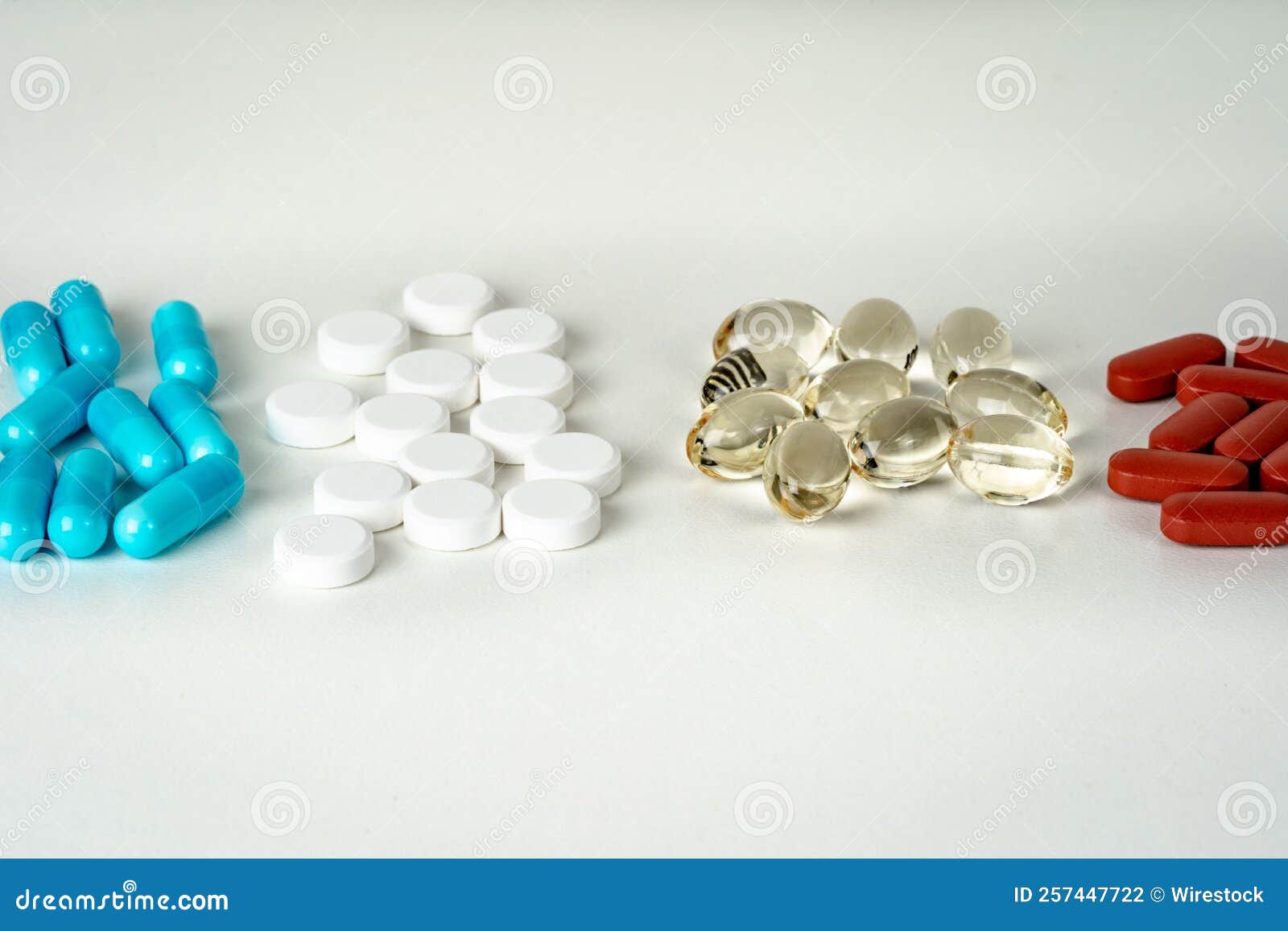Of Four Kinds of Pills on White Surface Stock Photo - Image of help ...
